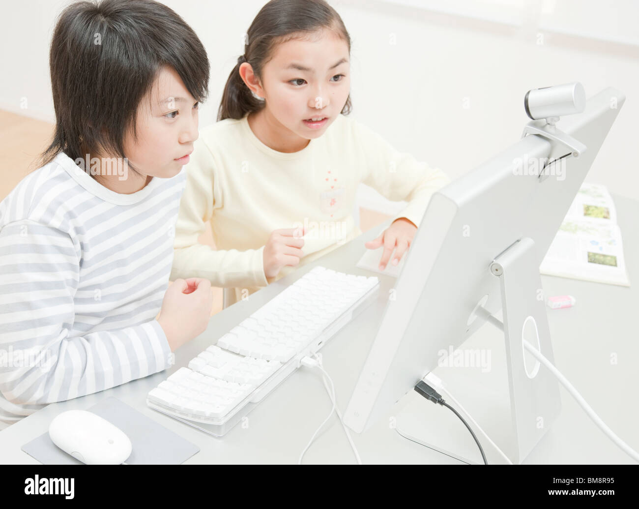 Children Studying at Desk, Desktop Computer on the Desk Stock Photo - Alamy