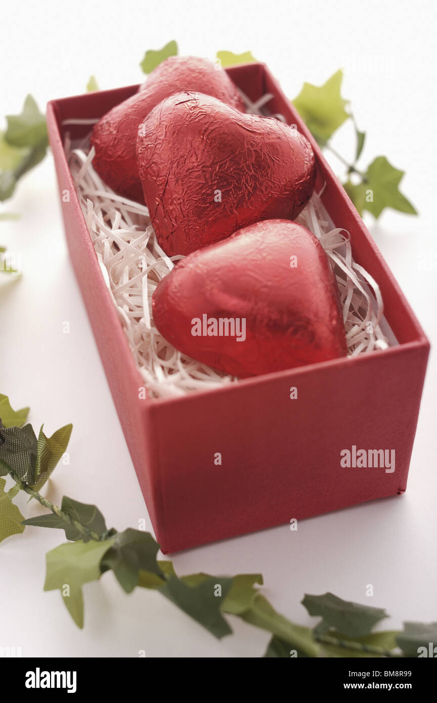 Three Red Heart Chocolates in Box Stock Photo - Alamy