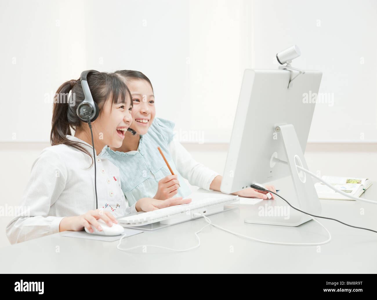 Girls Studying at Desk, Desktop Computer on the Desk Stock Photo - Alamy