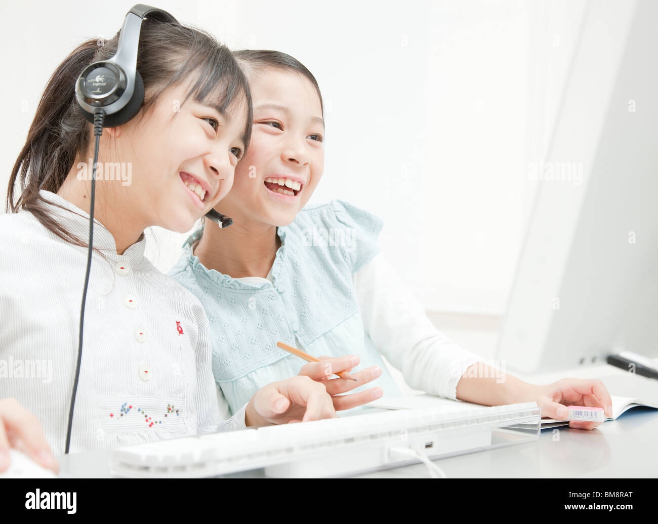 Girls Studying at Desk, Desktop Computer on the Desk Stock Photo - Alamy