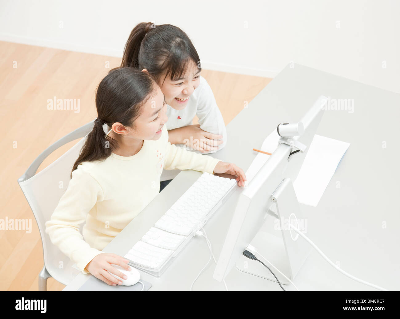 Girls Studying at Desk, Desktop Computer on the Desk Stock Photo - Alamy