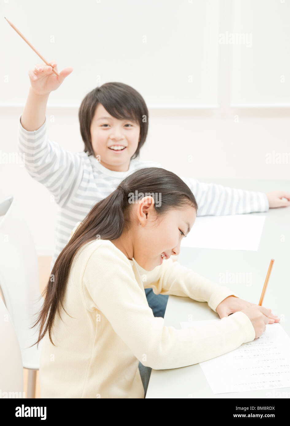 Children Studying at Desk Stock Photo - Alamy