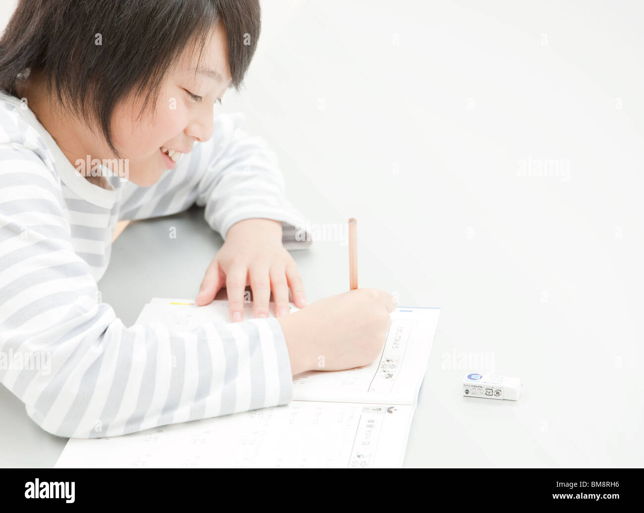 A Boy Studying at Desk Stock Photo - Alamy
