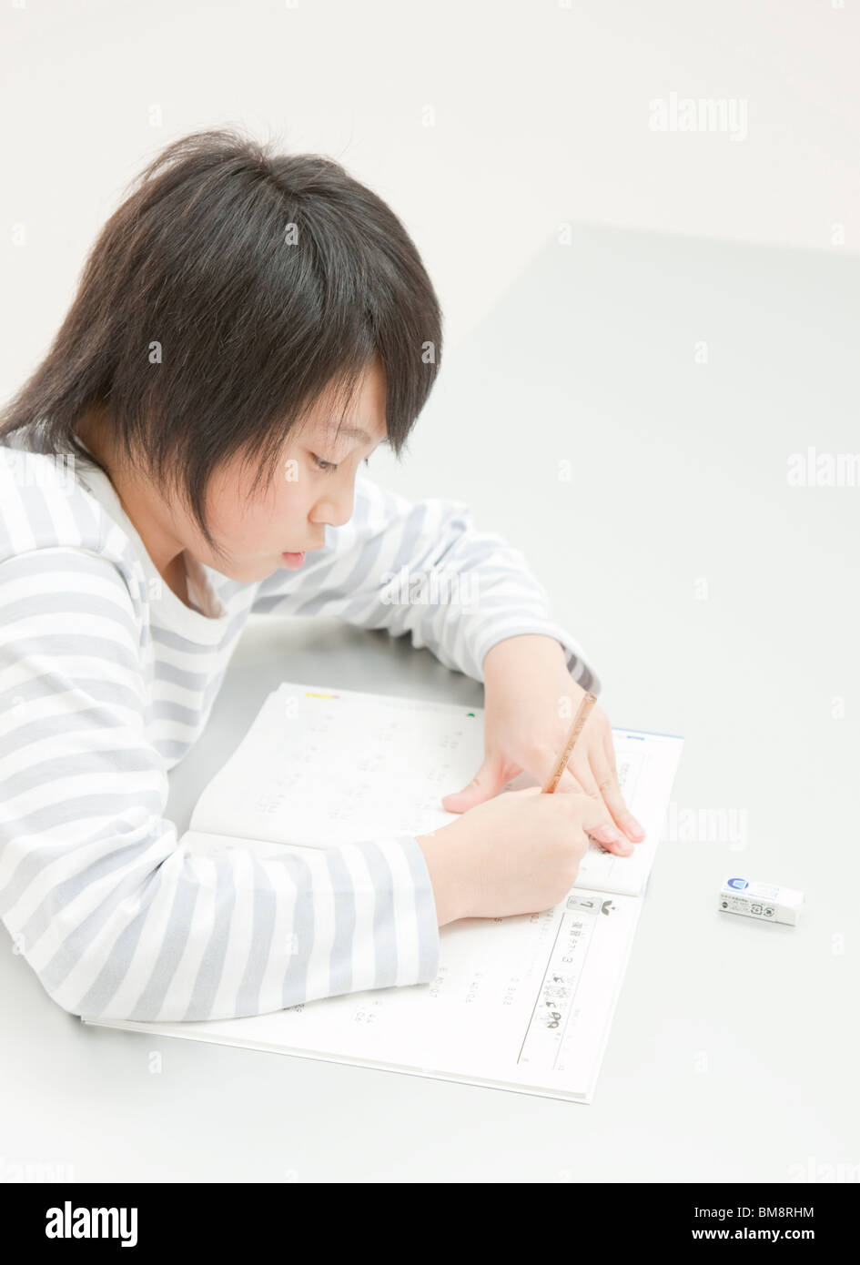 A Boy Studying at Desk Stock Photo - Alamy