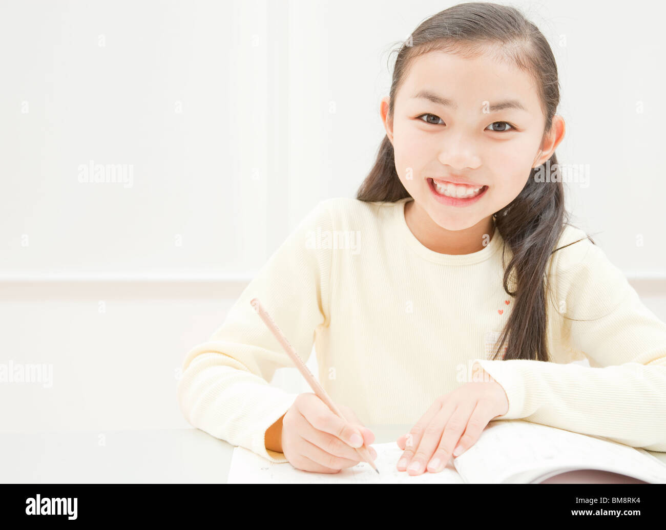 A Girl Studying at Desk Stock Photo - Alamy