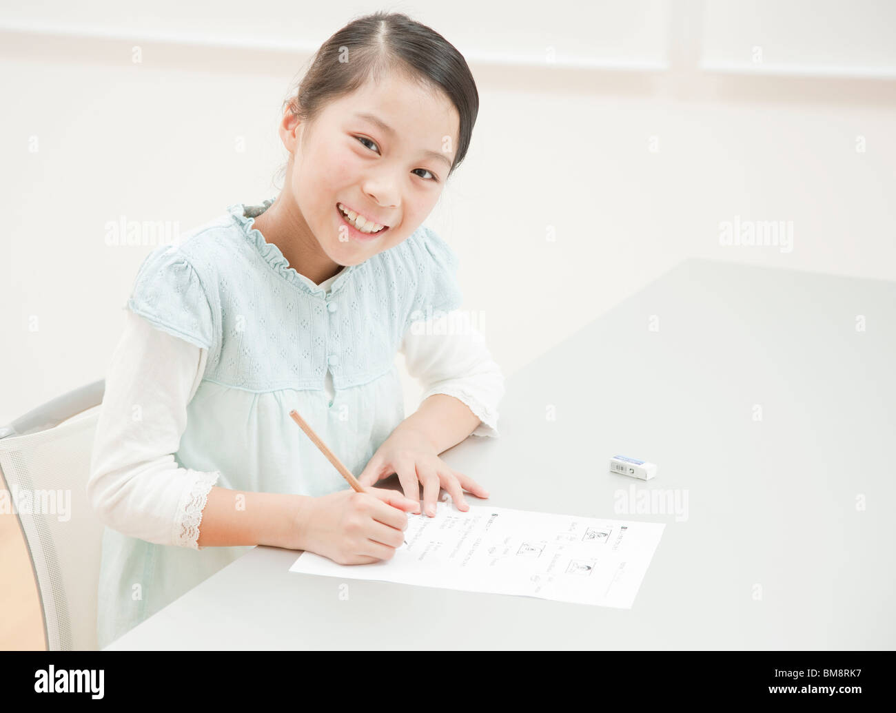 A Girl Studying at Desk Stock Photo - Alamy