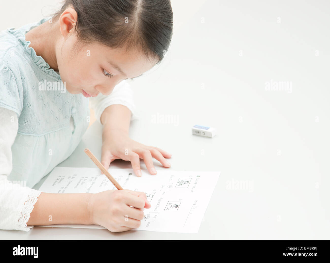 A Girl Studying at Desk Stock Photo - Alamy