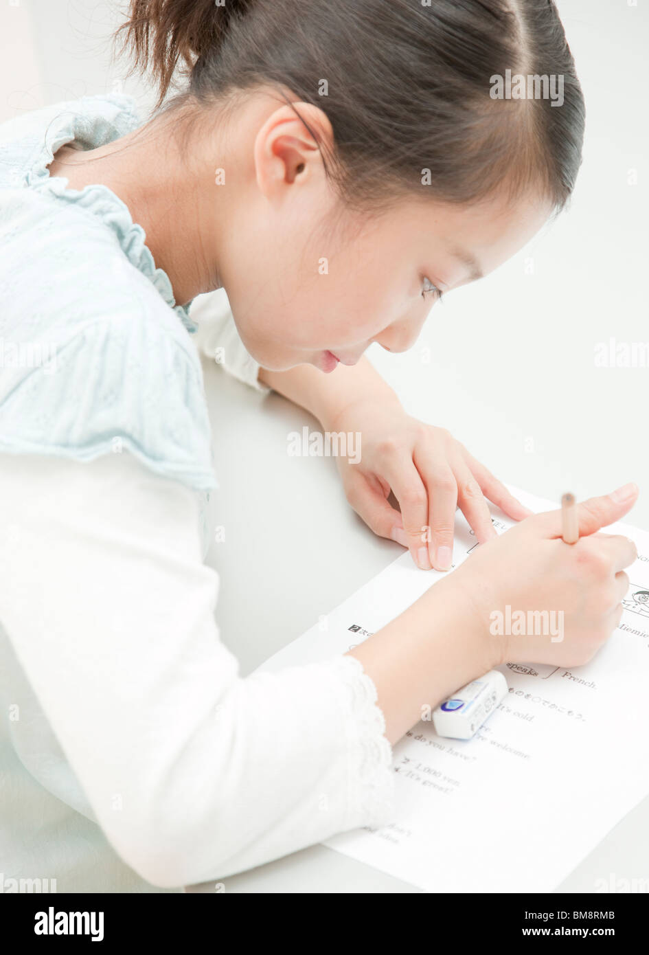 A Girl Studying at Desk Stock Photo - Alamy
