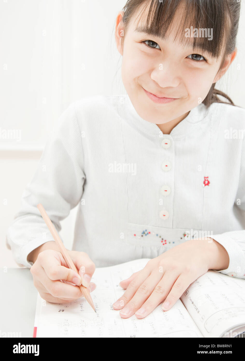 A Girl Studying at Desk Stock Photo - Alamy