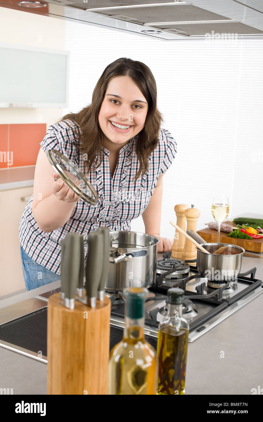 Cook - plus size woman in modern kitchen prepare meal Stock Photo - Alamy
