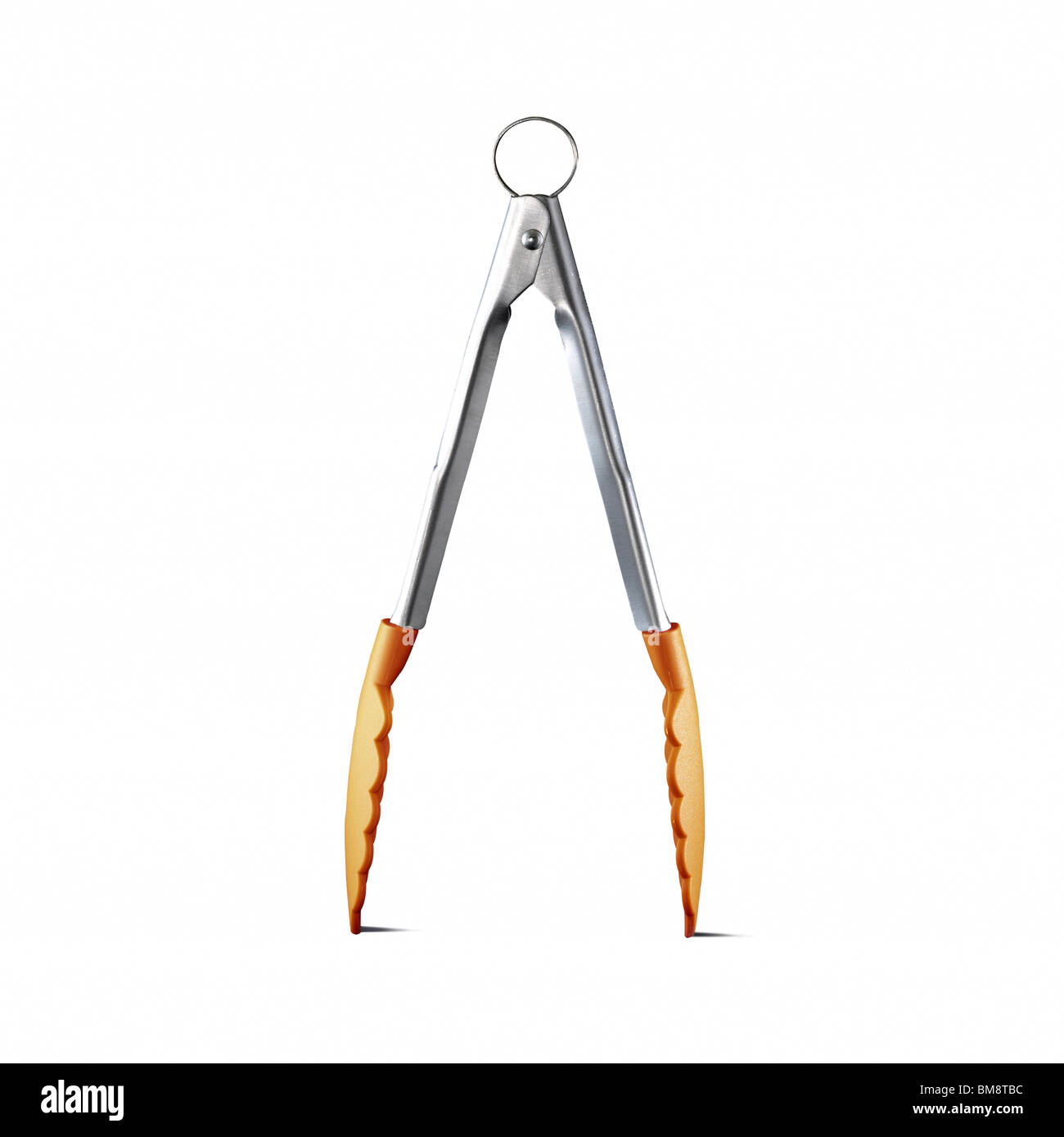 Tongs on white background, cut out Stock Photo - Alamy