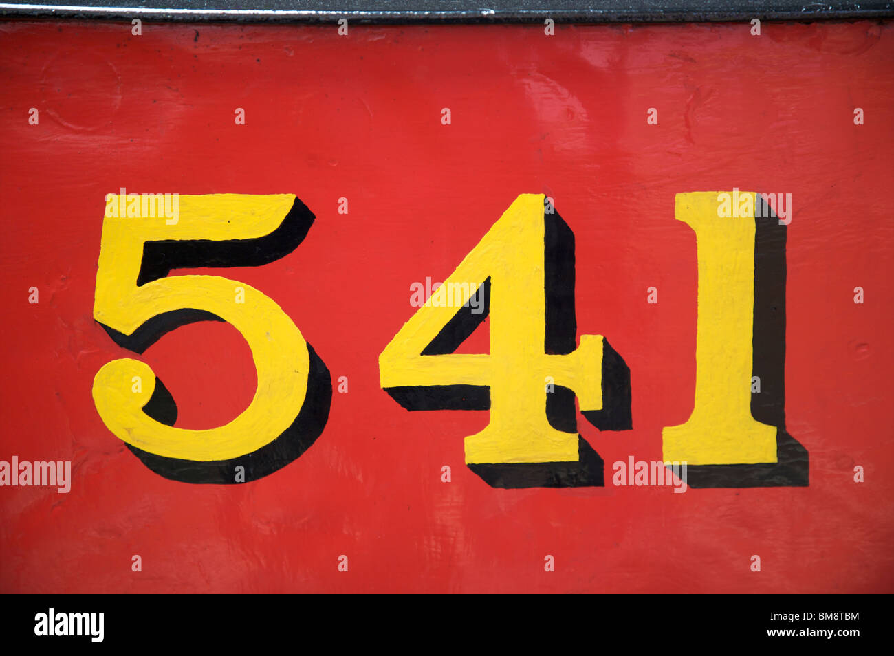 541 painted in yellow on a red background on a steam locomotive Stock ...