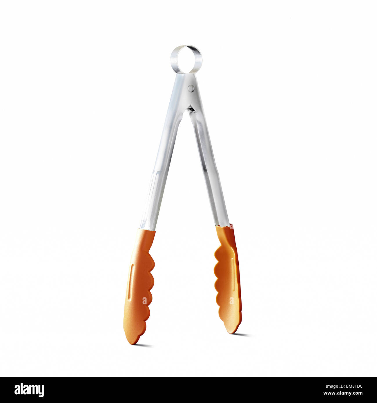 Tongs on white background, cut out Stock Photo - Alamy