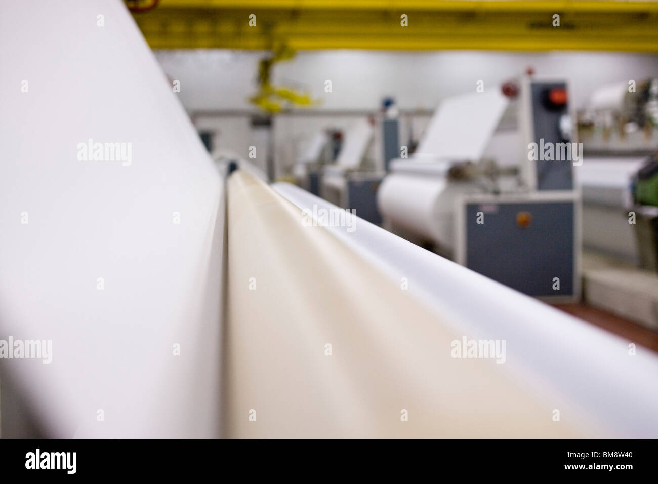 Coating machine in fabric coating plant Stock Photo - Alamy