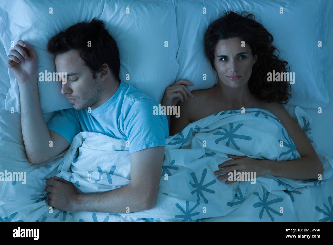 Sleeping man women awake hi-res stock photography and images - Alamy
