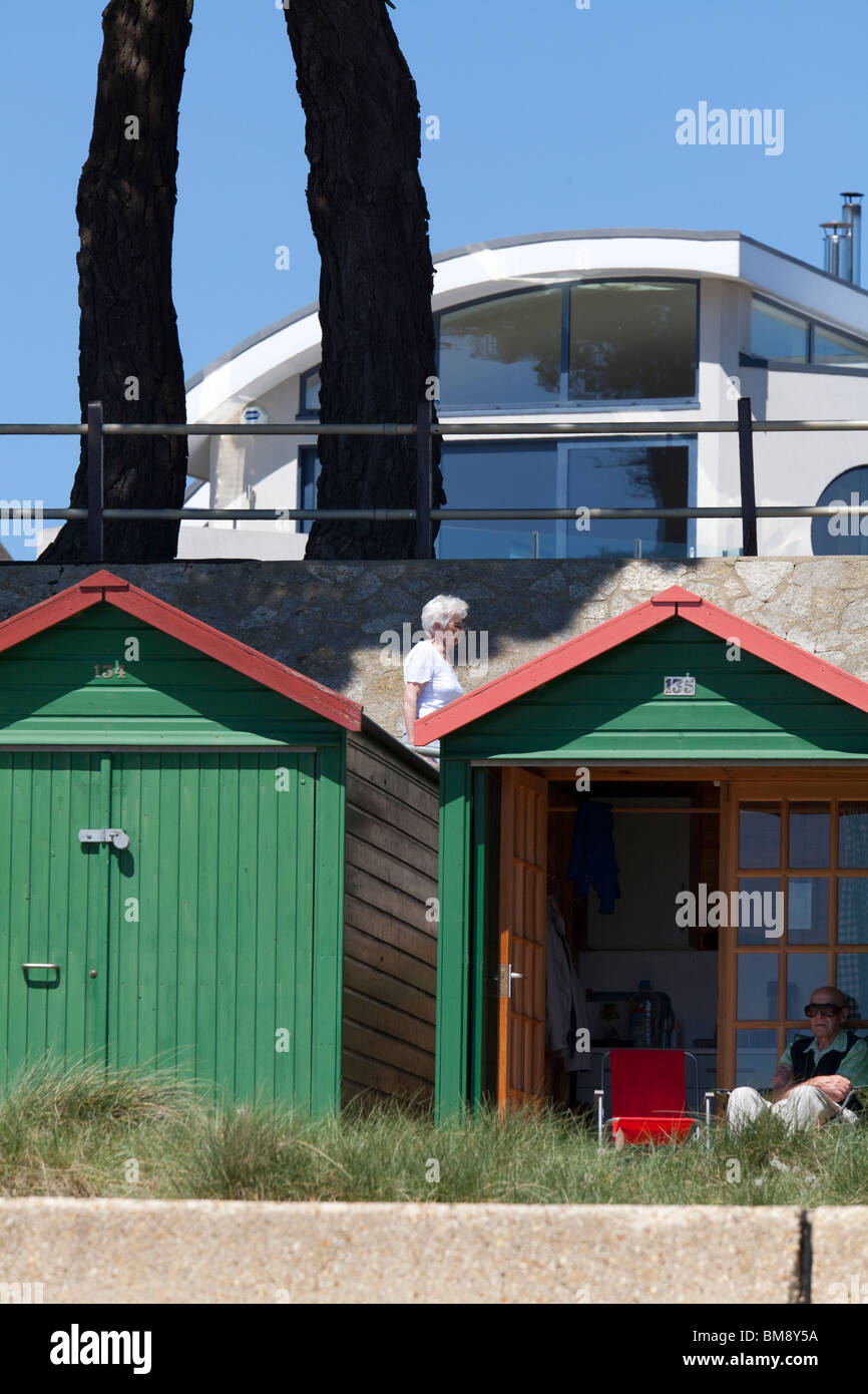 green beach huts at Mudeford Stock Photo - Alamy
