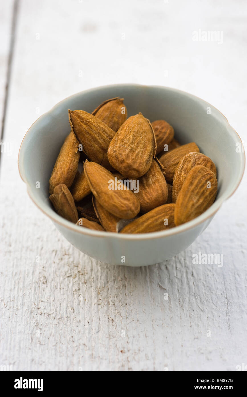 Almonds in bowl Stock Photo - Alamy