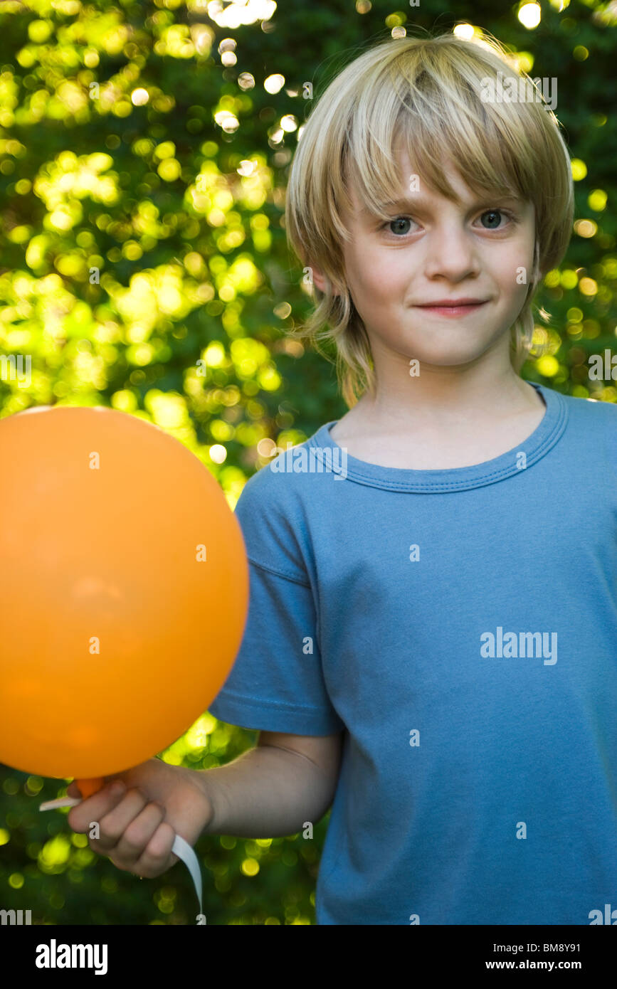 Boy with balloon, portrait Stock Photo - Alamy