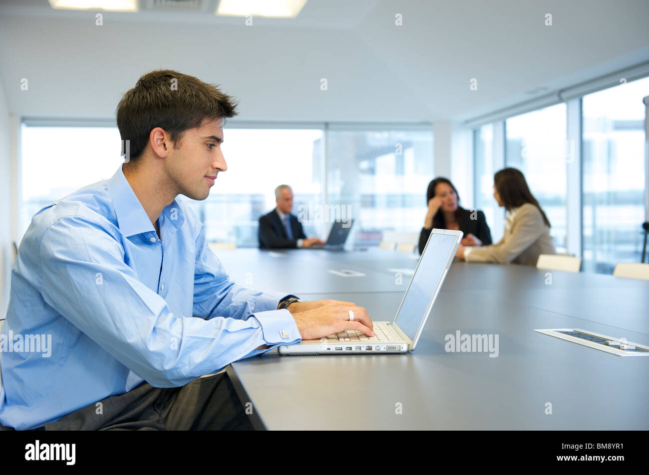 Young professionals and laptops hi-res stock photography and images - Alamy