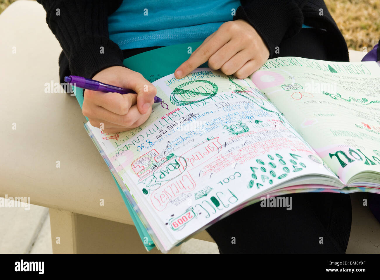 Teen writing on lined paper hi-res stock photography and images - Alamy
