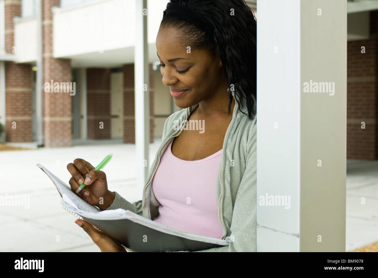 Young female student writes notes hi-res stock photography and images ...