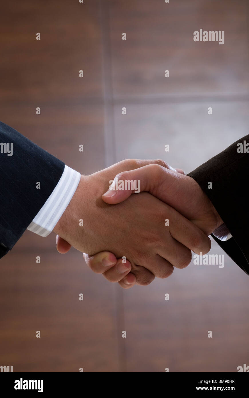 Business men handshake Stock Photo - Alamy