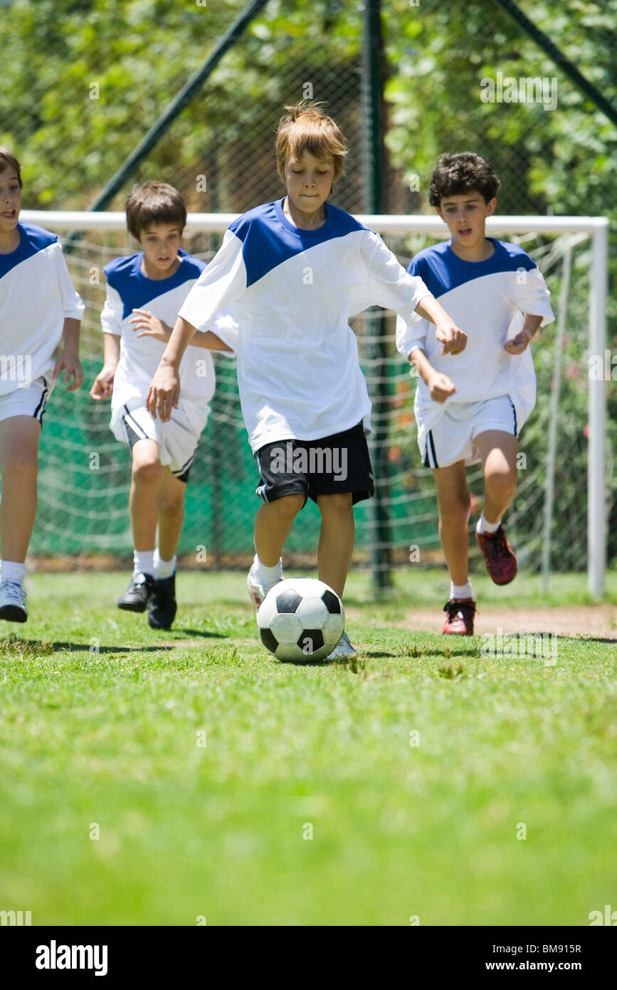Children playing soccer, cropped Stock Photo - Alamy