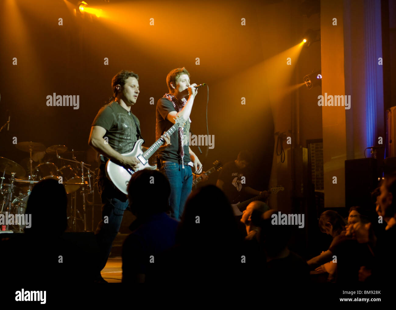 Rock band playing on stage Stock Photo - Alamy