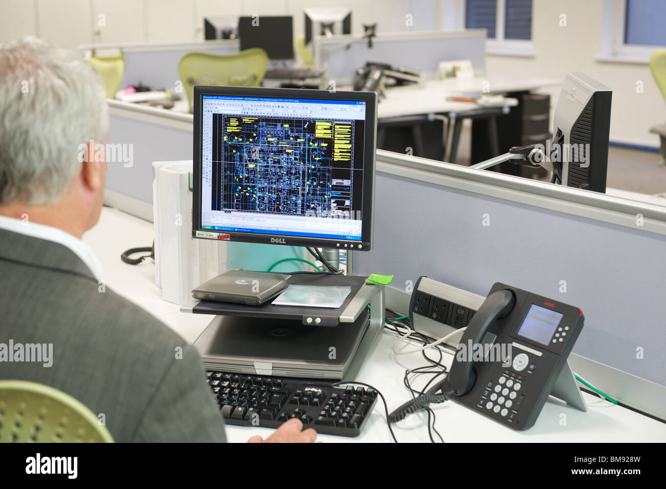 Man at desk showing CAD design on screen Stock Photo - Alamy
