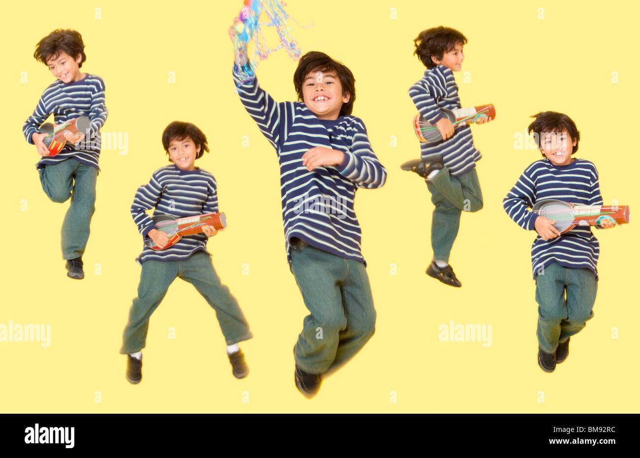 Boys playing musical instruments hi-res stock photography and images ...