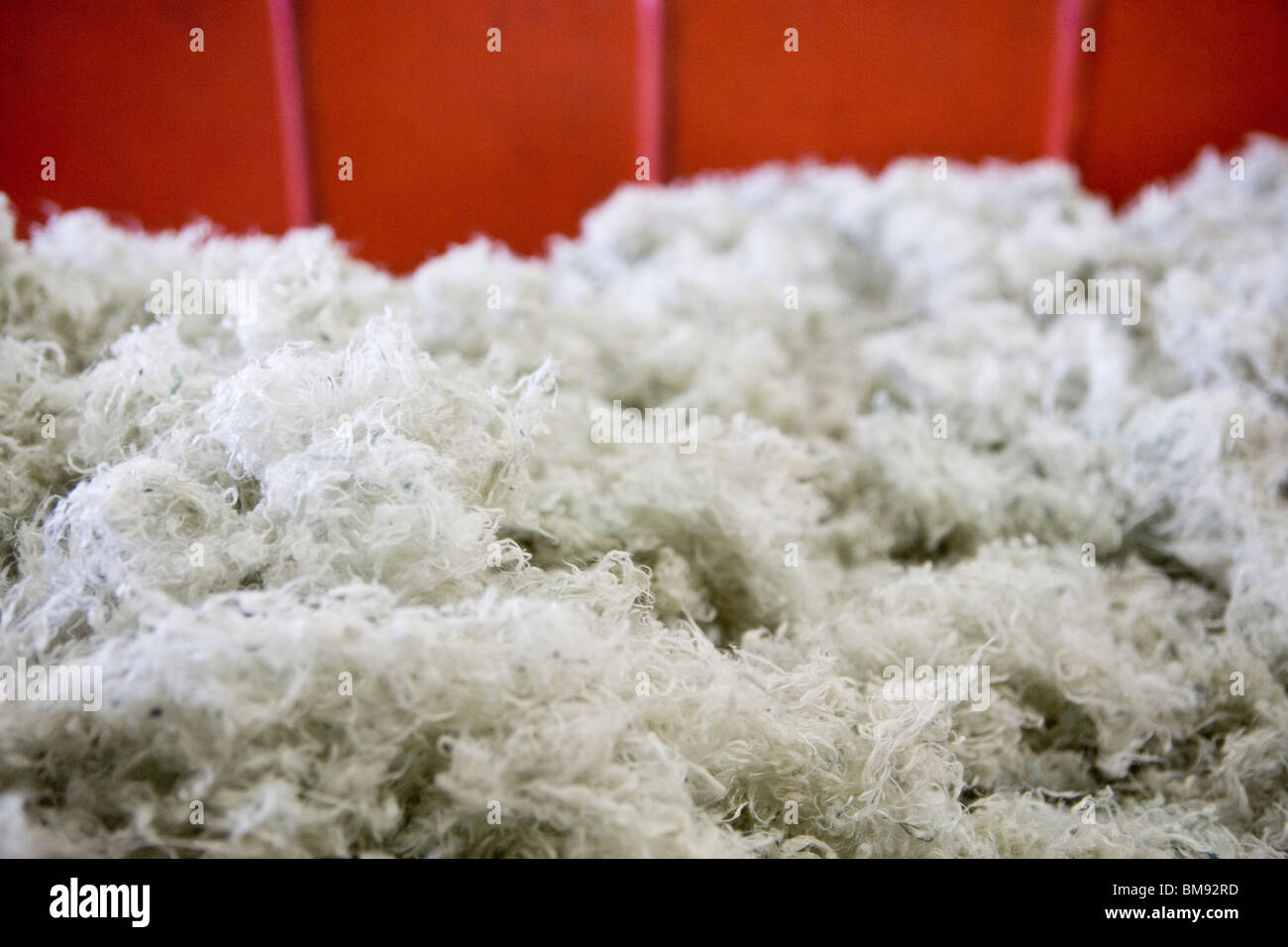 Polyester fibers obtained after PVC sheeting has been crushed and ...