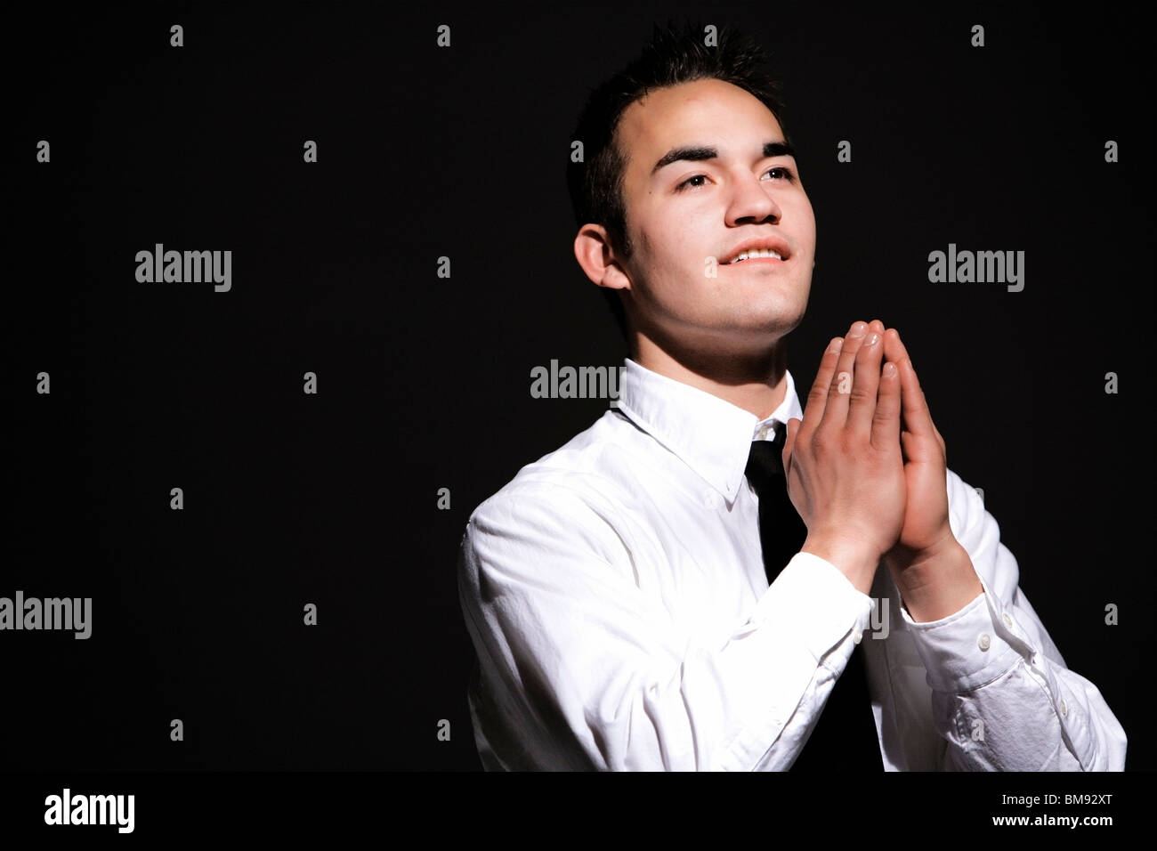 Young Man Praying Stock Photo - Alamy