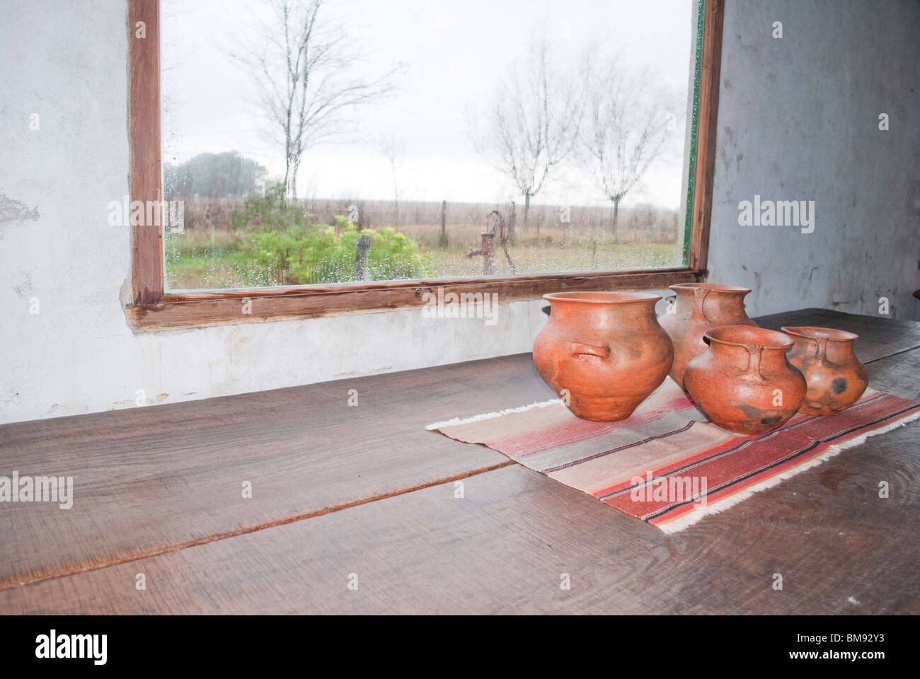 clay pots in the window Stock Photo - Alamy