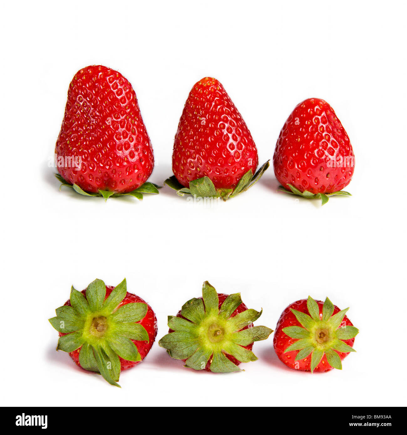 Standing and lying strawberries on white background Stock Photo - Alamy