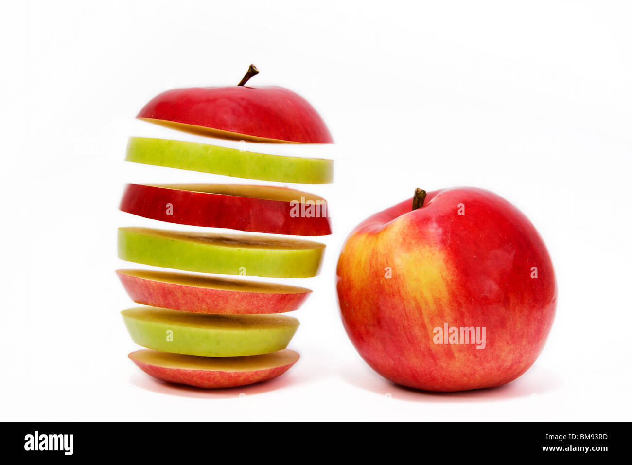 Flying apple on white background Stock Photo - Alamy