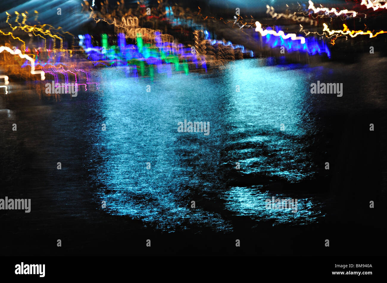 Reflections of neon light on water Stock Photo - Alamy