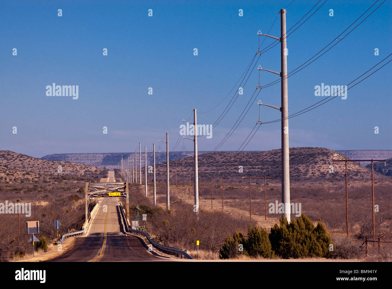New power line and Pecos River bridge on Highway US-290 at sunset in ...