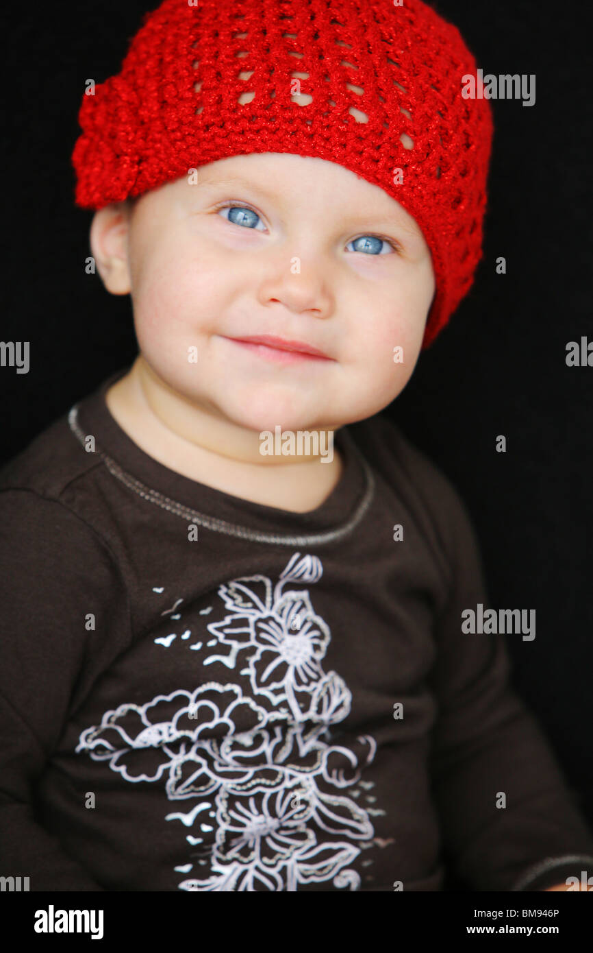 Baby In Red Hat Stock Photo - Alamy