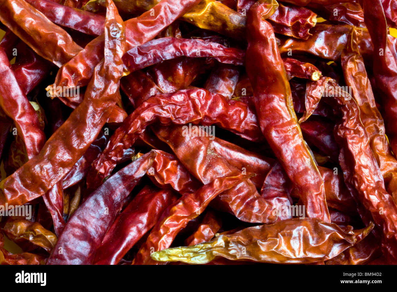 Closeup dried red chilli background Stock Photo - Alamy