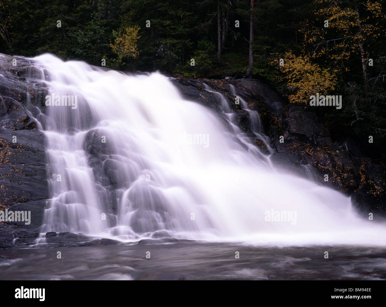 Flowing water from mountain waterfall Stock Photo - Alamy