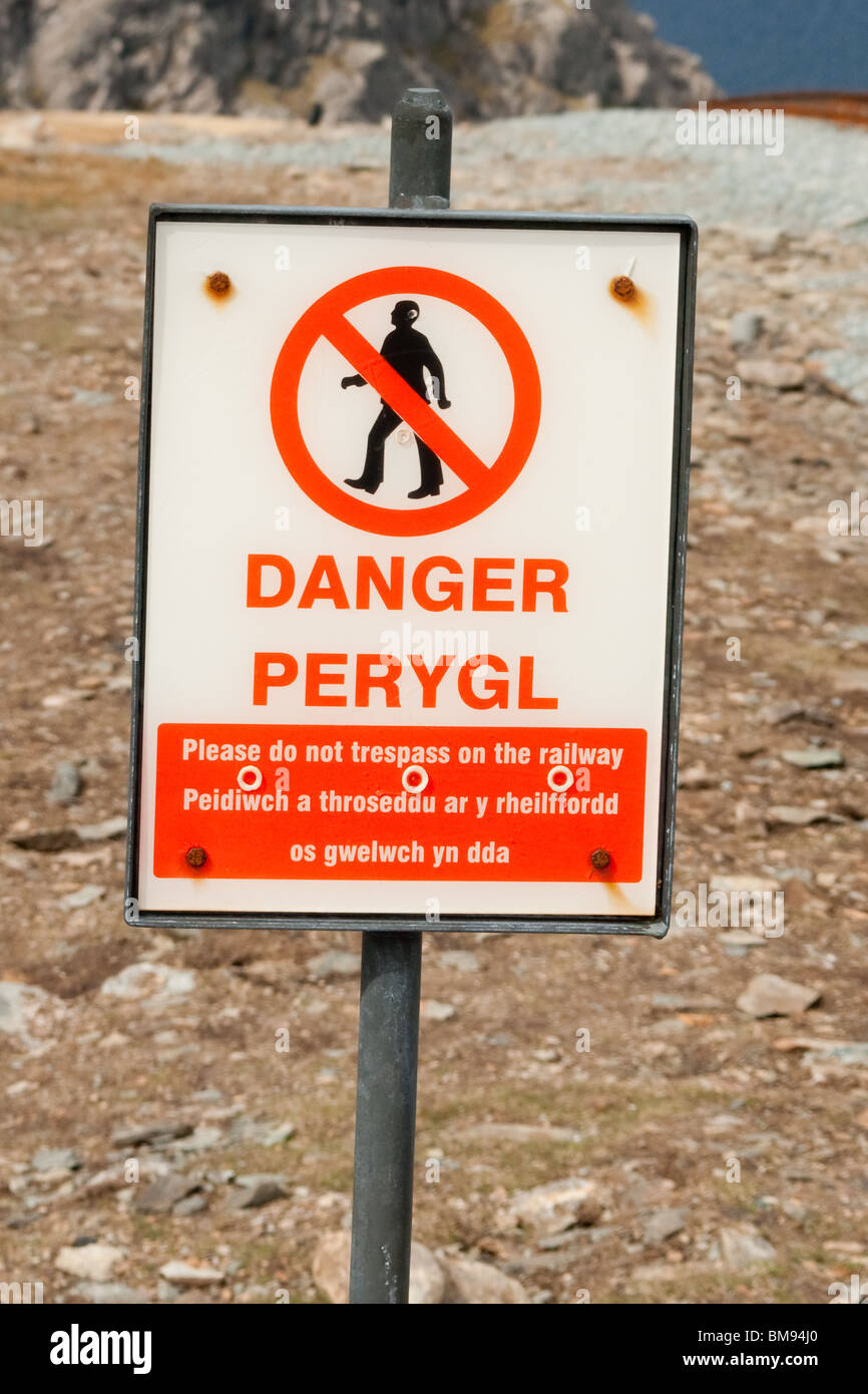 Danger sign in English and Welsh, warning people not to trespass on the ...