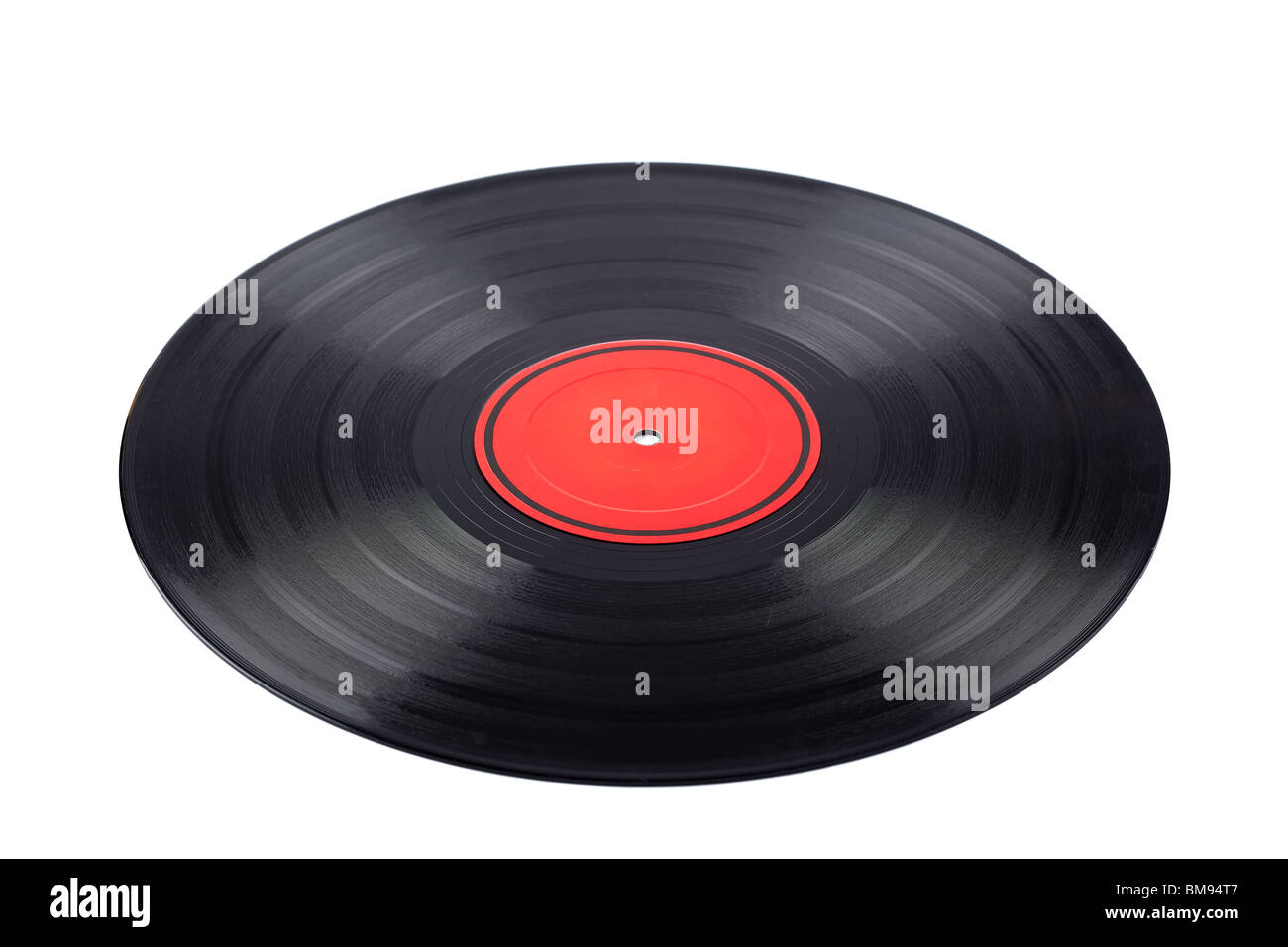 Dusty vinyl record with red label isolated on white background. Shallow ...