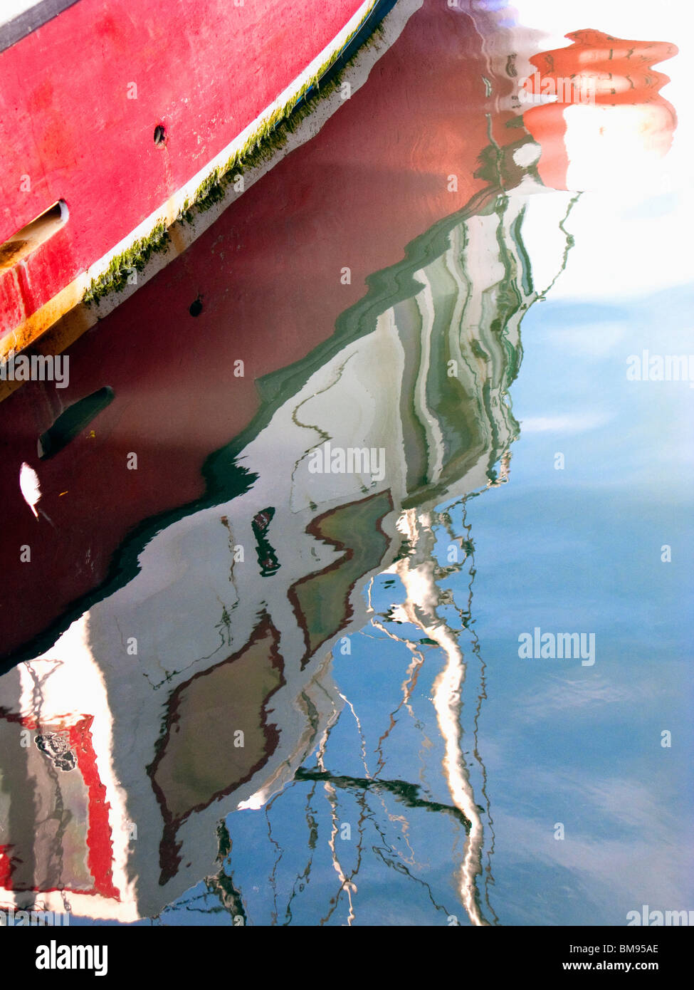 Abstract Reflection of Fishing Boat in Ocean Stock Photo - Alamy