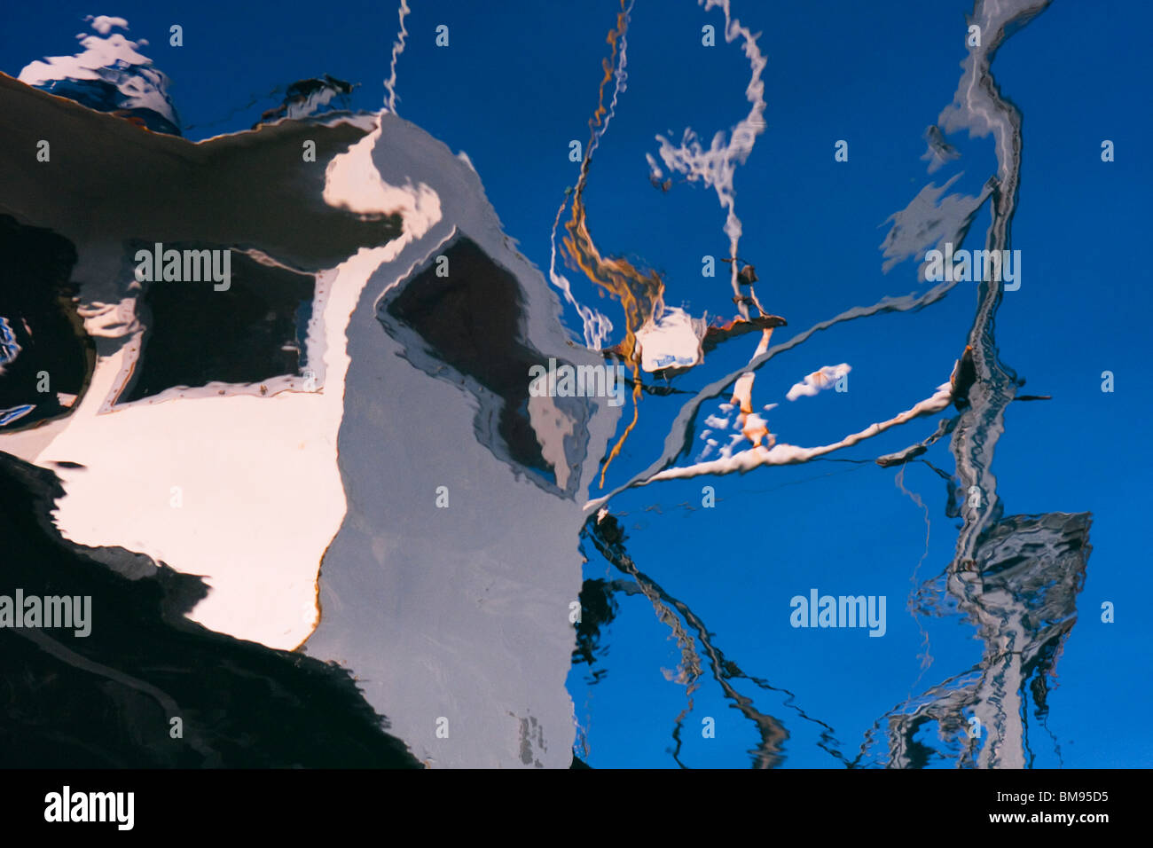 Abstract Reflection of Fishing Boat in Ocean Stock Photo - Alamy