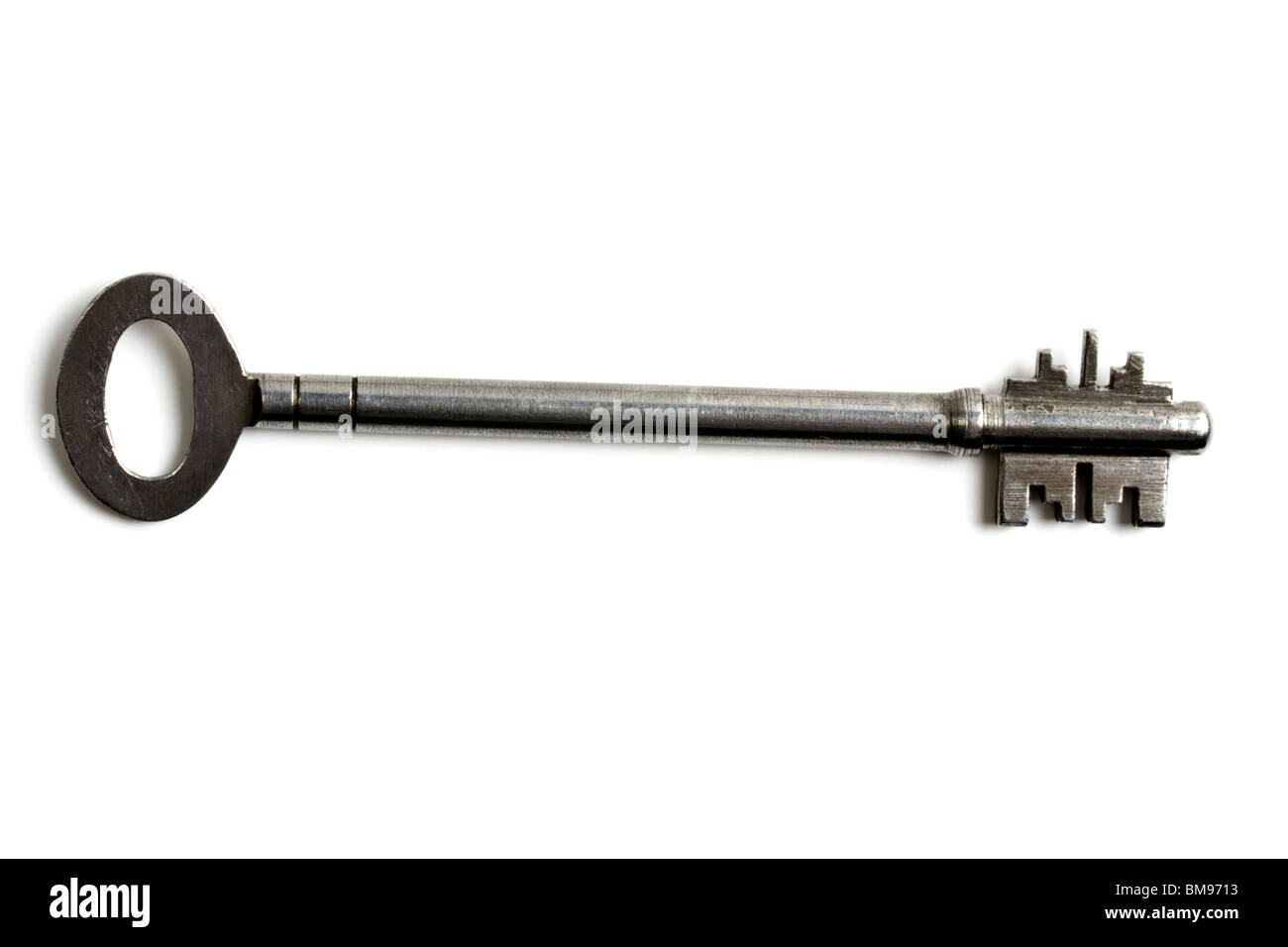 An old key isolated on white background Stock Photo - Alamy