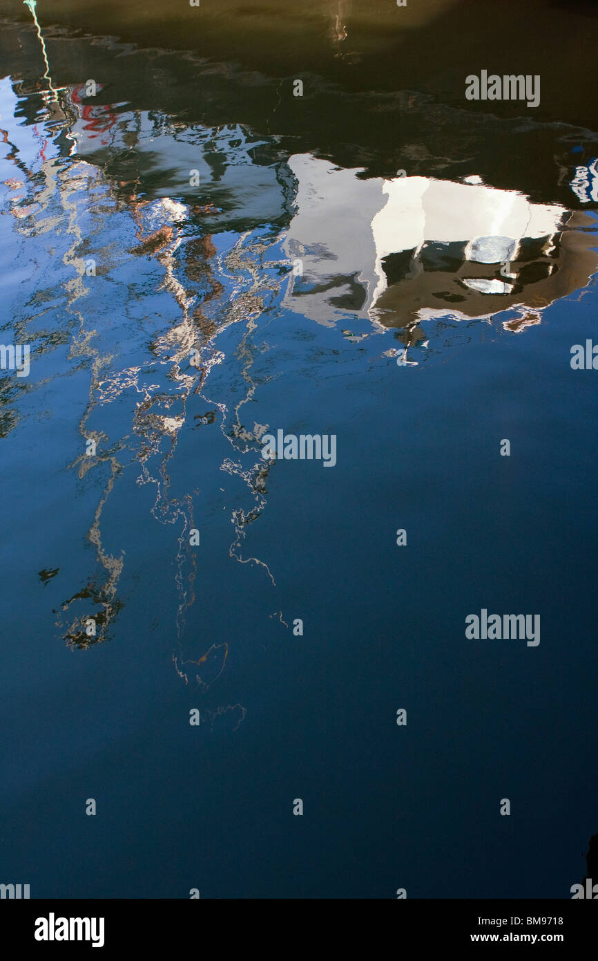 Abstract Reflection of Fishing Boat in Ocean Stock Photo - Alamy