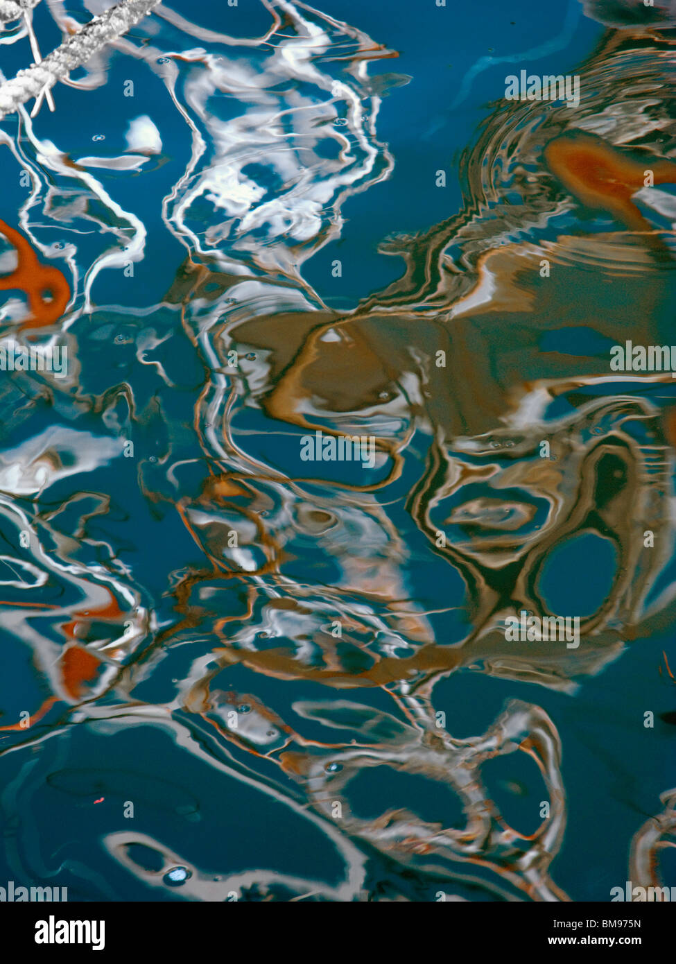 Abstract Reflection of Fishing Boat in Ocean Stock Photo - Alamy