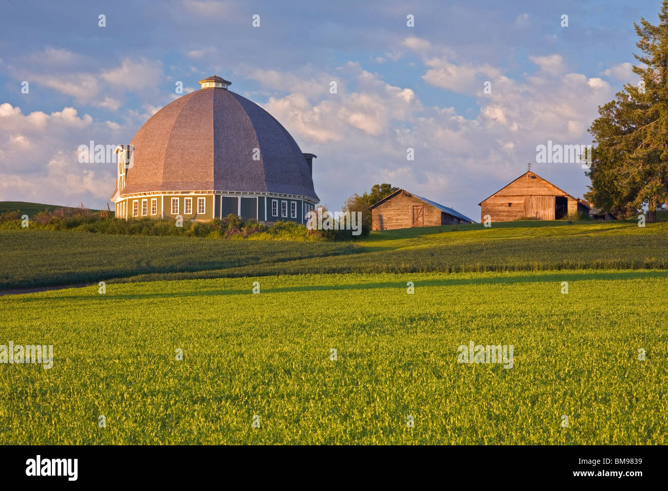 Whitman County, WA Morning sun on round barn under clearing skies Stock ...