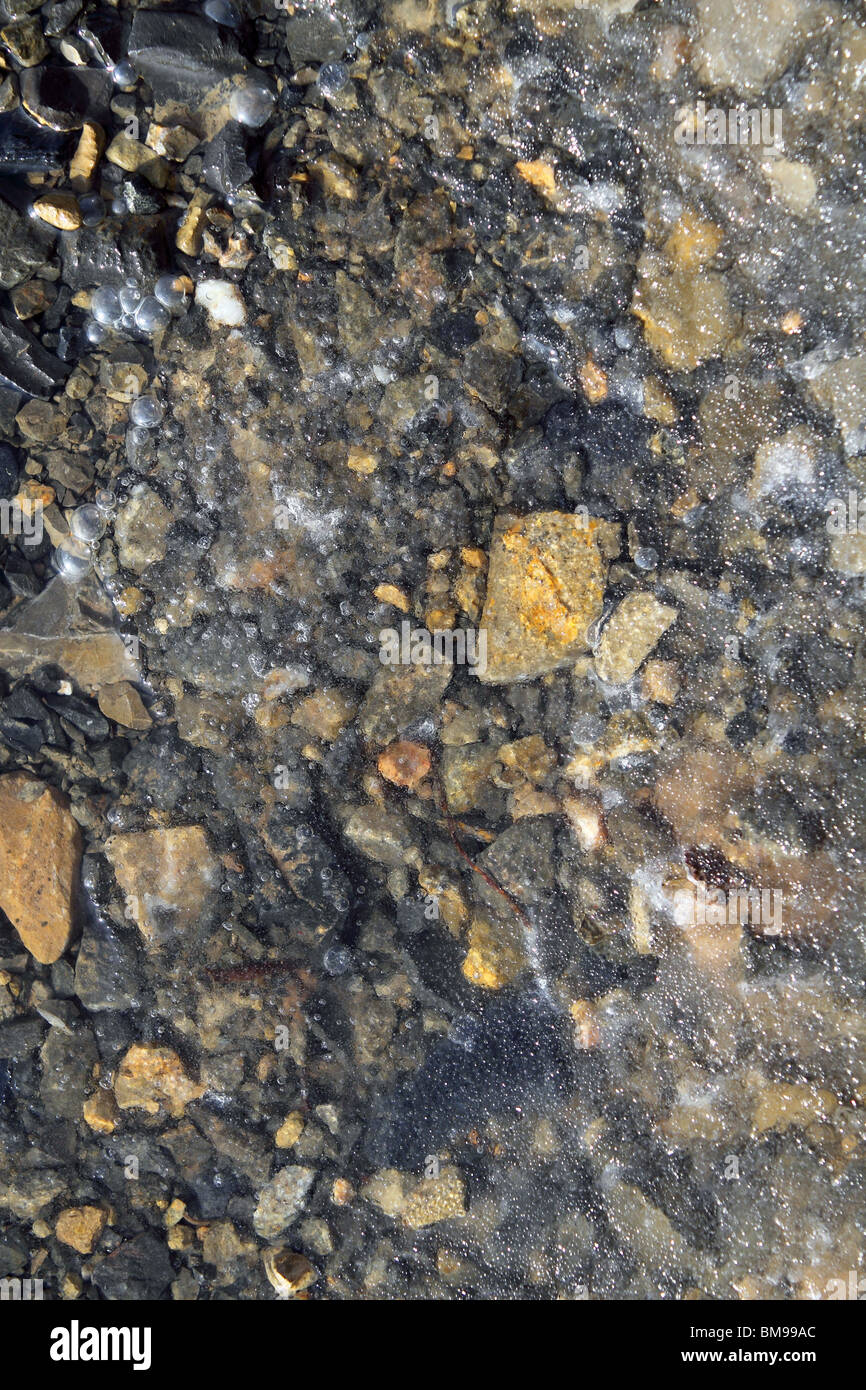 Iced stones soil in winter translucent ice background texture Stock ...