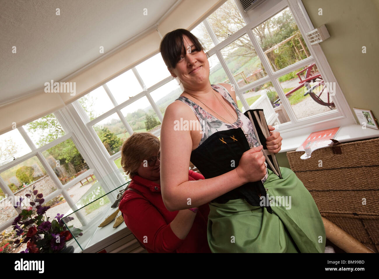 UK, Cornwall, Launceston, Lawrence House Museum, local women dressing ...